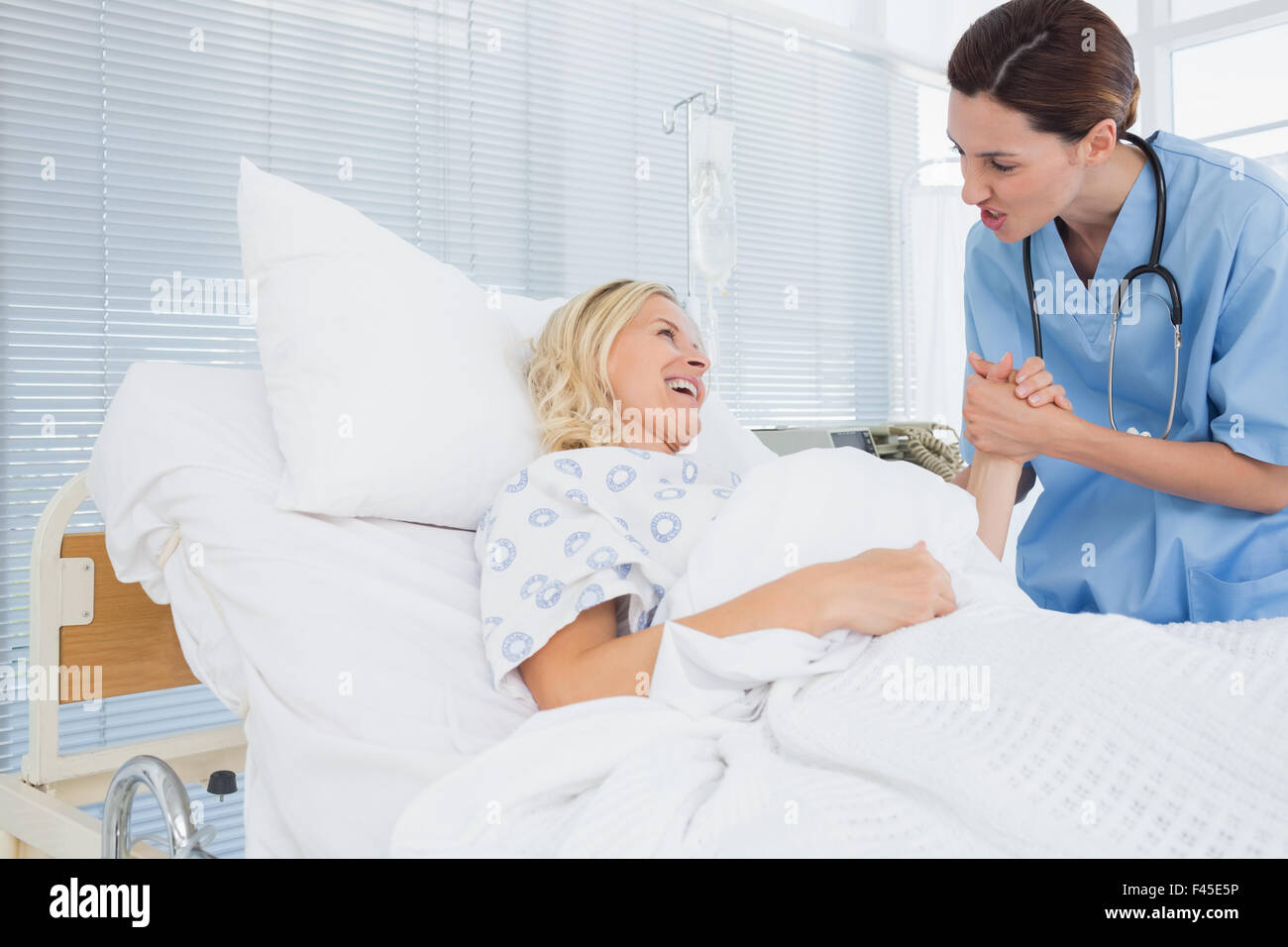 Doctor taking care of patient Stock Photo - Alamy