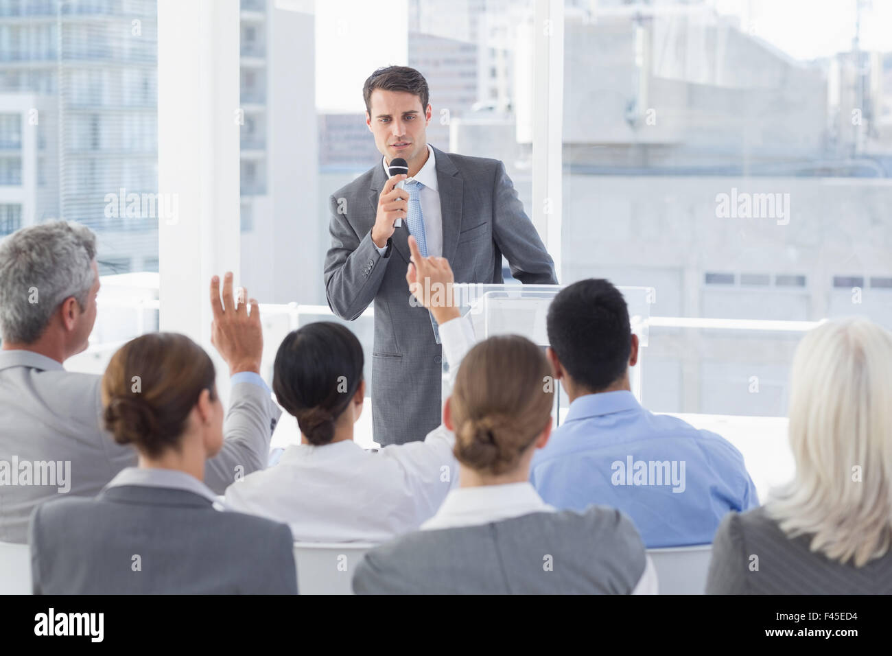 Businessman doing speech during meeting Stock Photo - Alamy