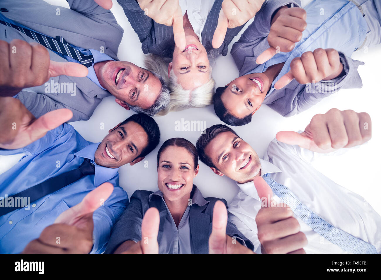 Business people gesturing thumbs up Stock Photo - Alamy