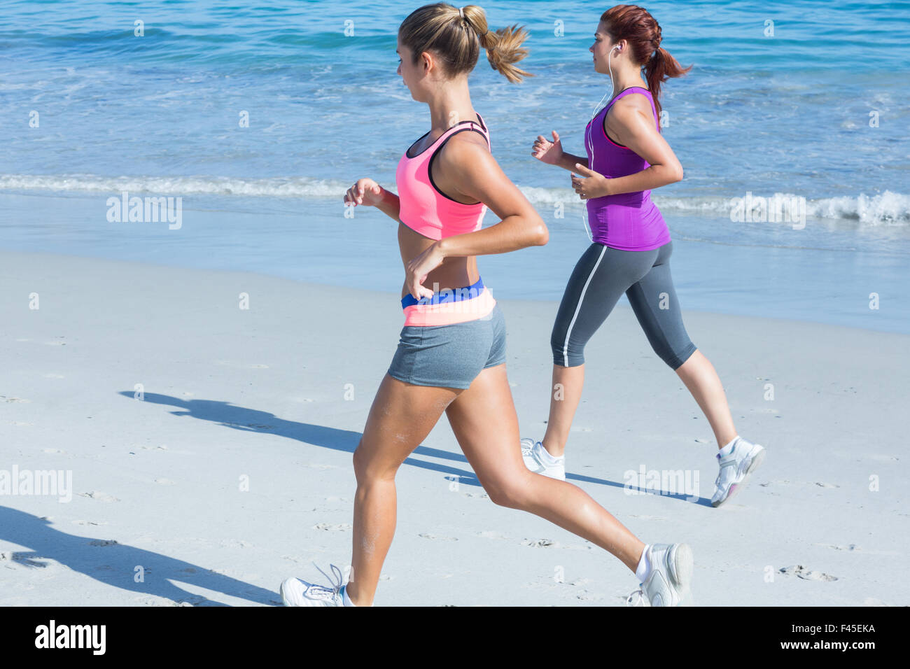 Friends doing jogging together Stock Photo - Alamy