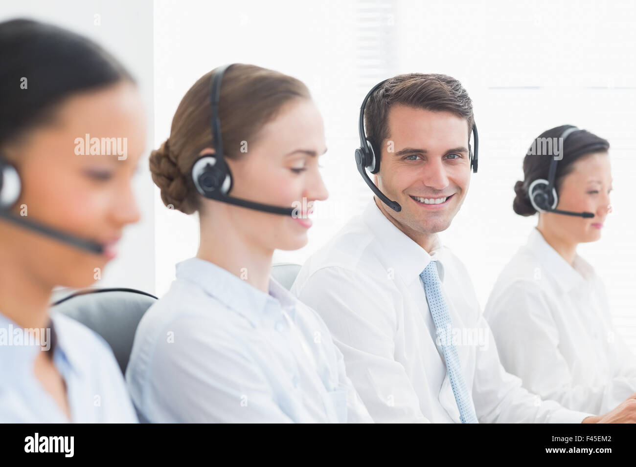 Call center people in headsets hi-res stock photography and images - Alamy