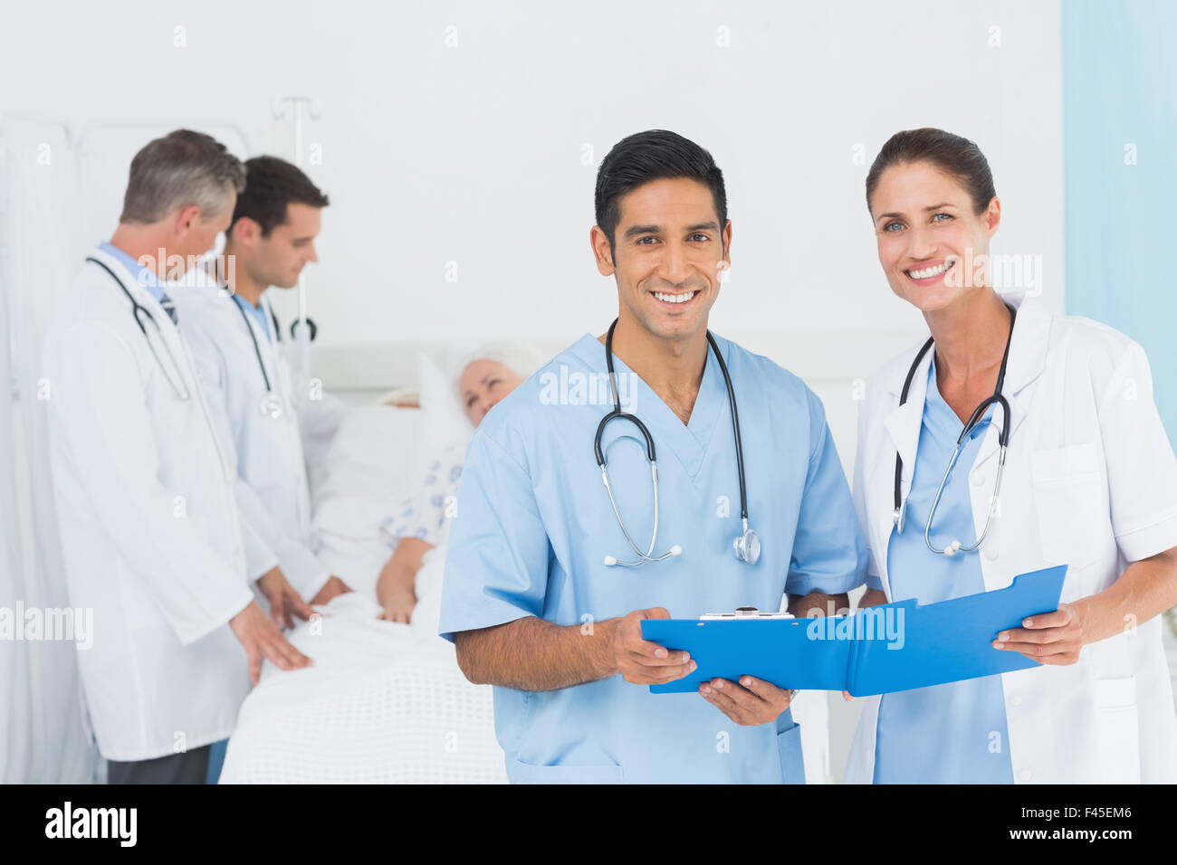 Report reading with patient behind Stock Photo - Alamy