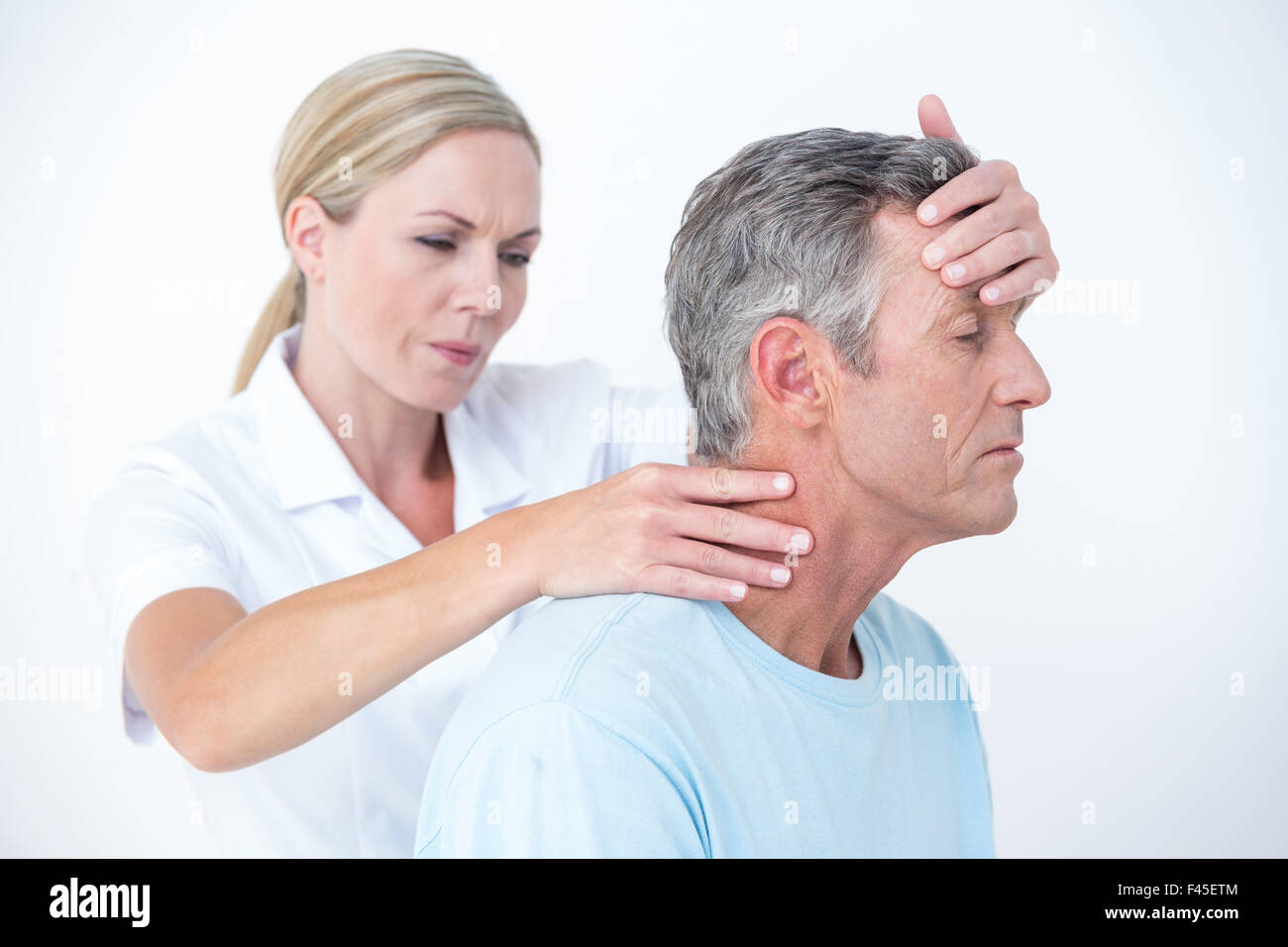 Doctor stretching her patient neck Stock Photo - Alamy
