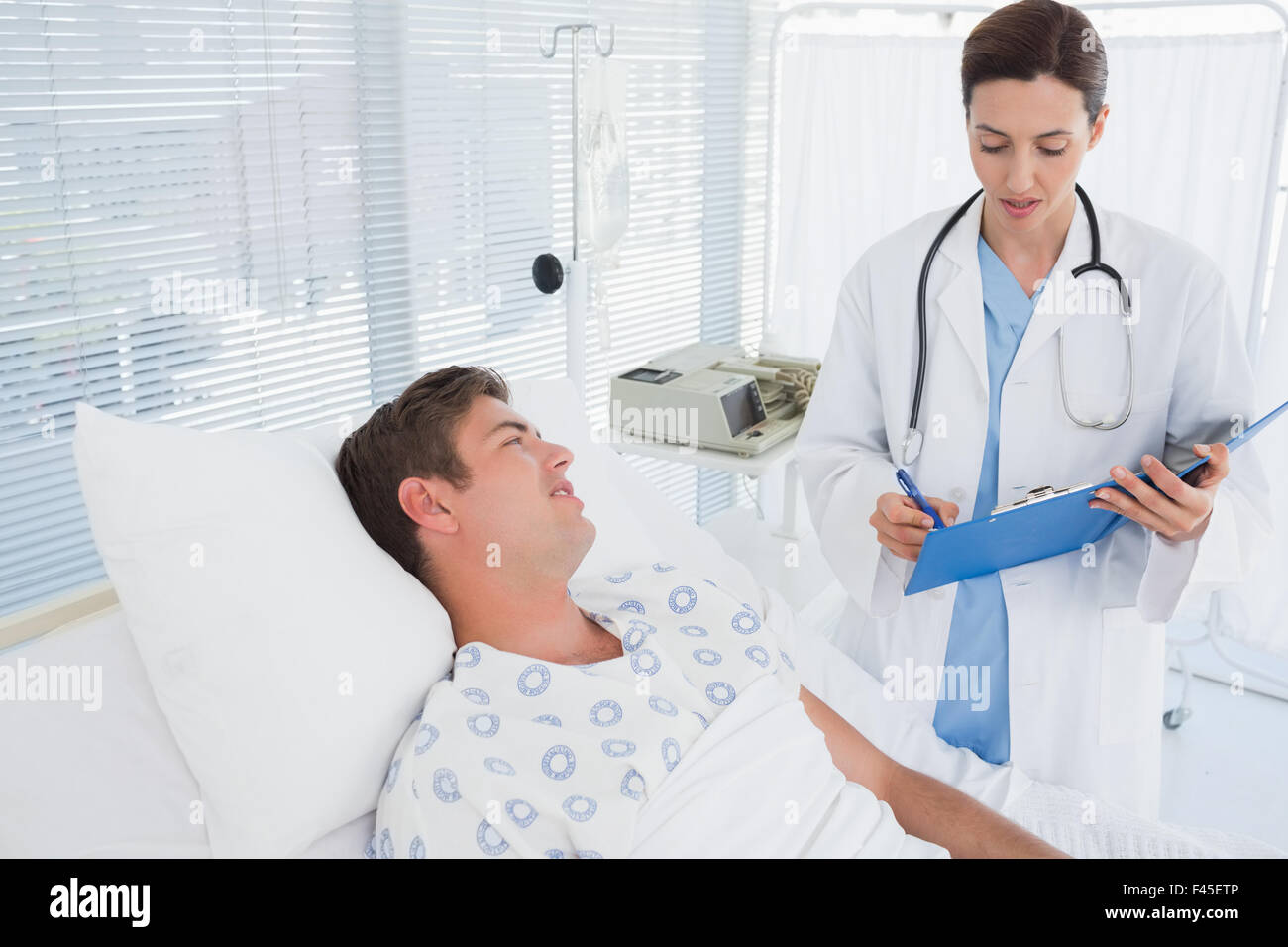 Doctor taking care of patient Stock Photo - Alamy