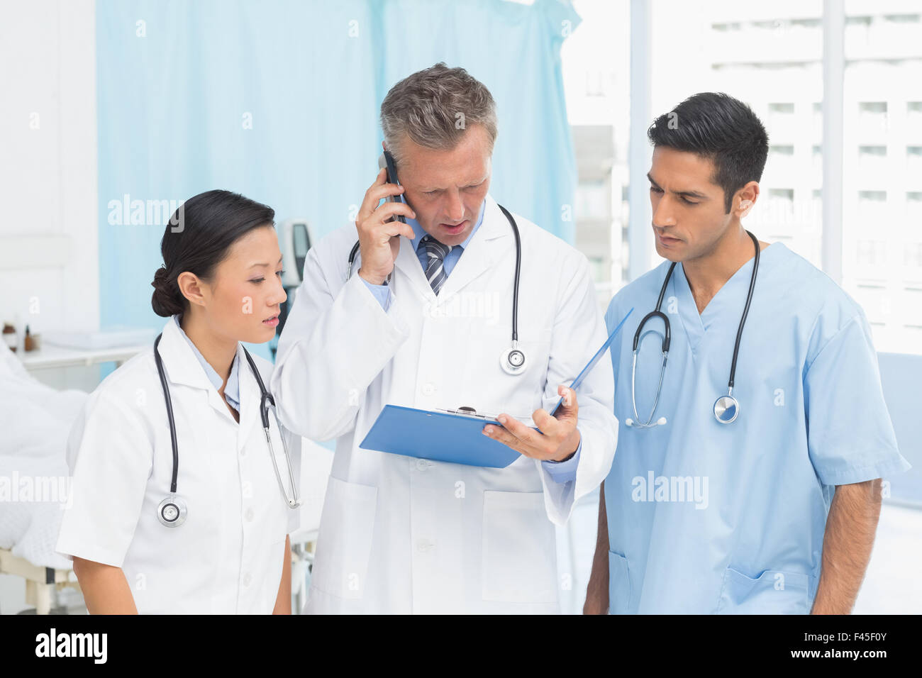 Doctor on phone Stock Photo - Alamy