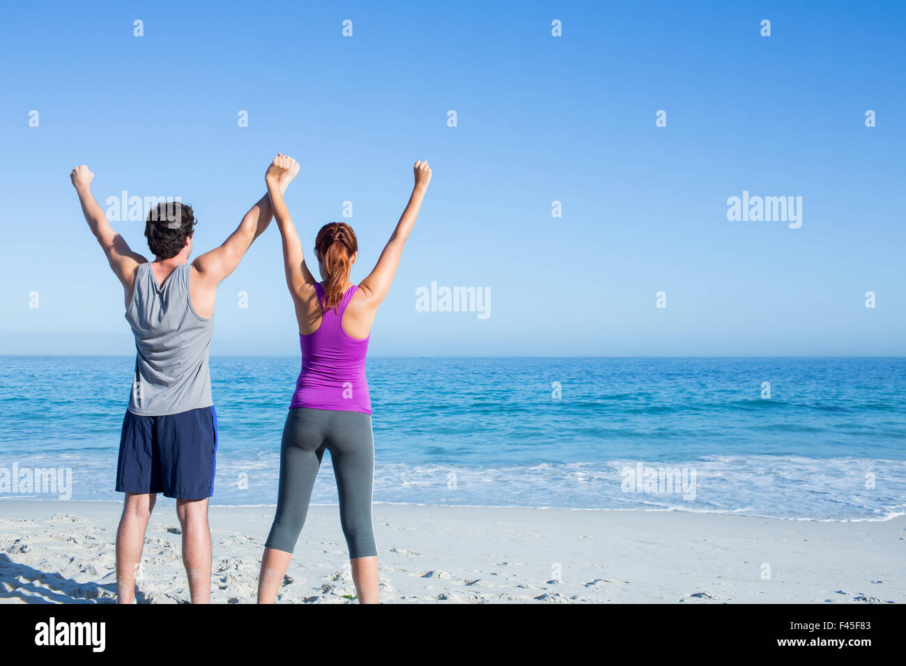 Happy couple raising their hands Stock Photo - Alamy Happy couple raising their hands Stock Photo - Alamy