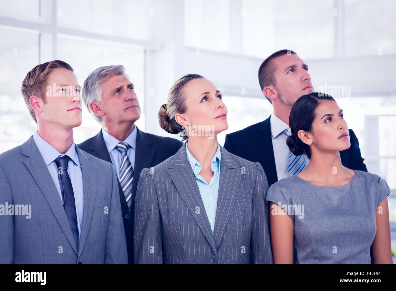 Business team looking up Stock Photo - Alamy
