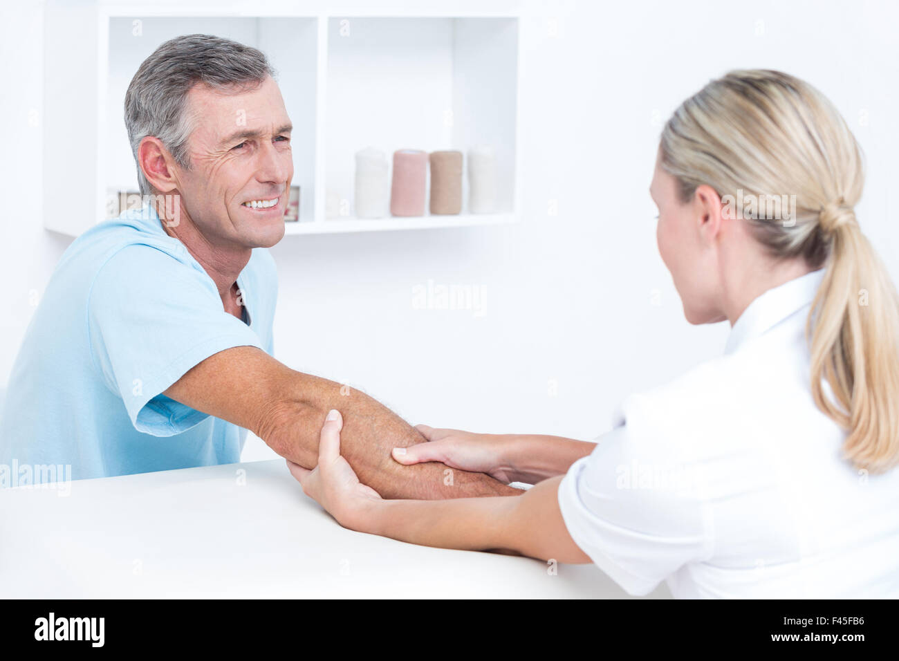 Doctor doing arm massage Stock Photo - Alamy