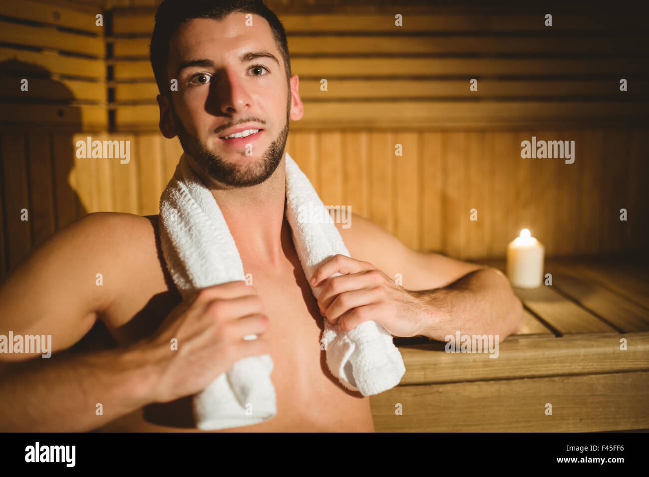 Man sitting inside a sauna Stock Photo - Alamy