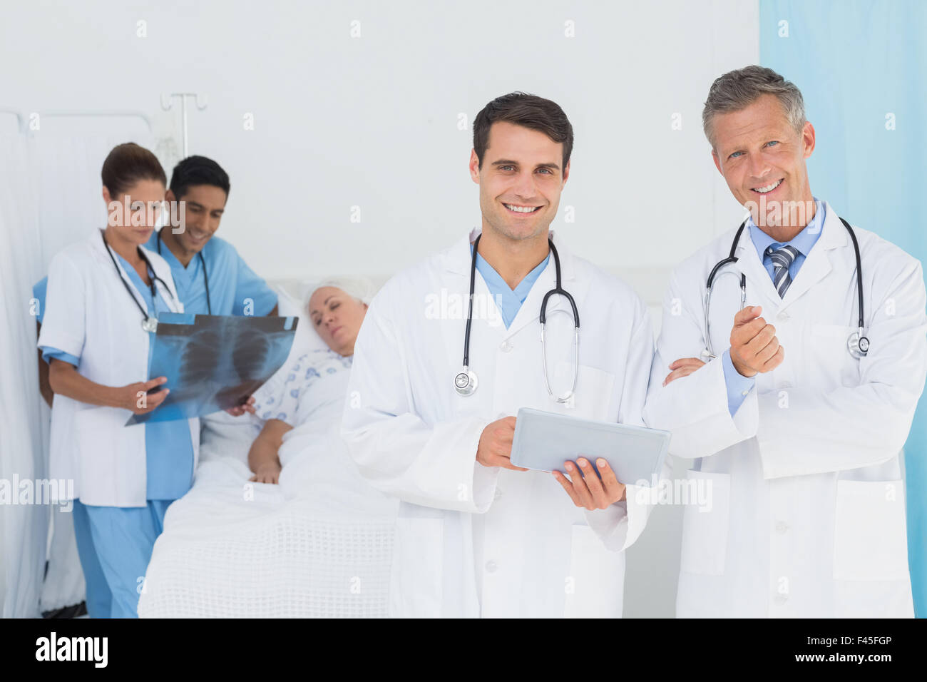 Report reading with patient behind Stock Photo - Alamy
