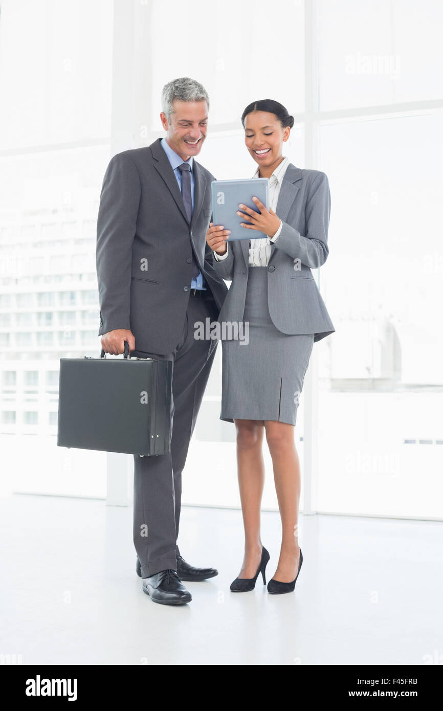 Business people using tablet computer Stock Photo - Alamy