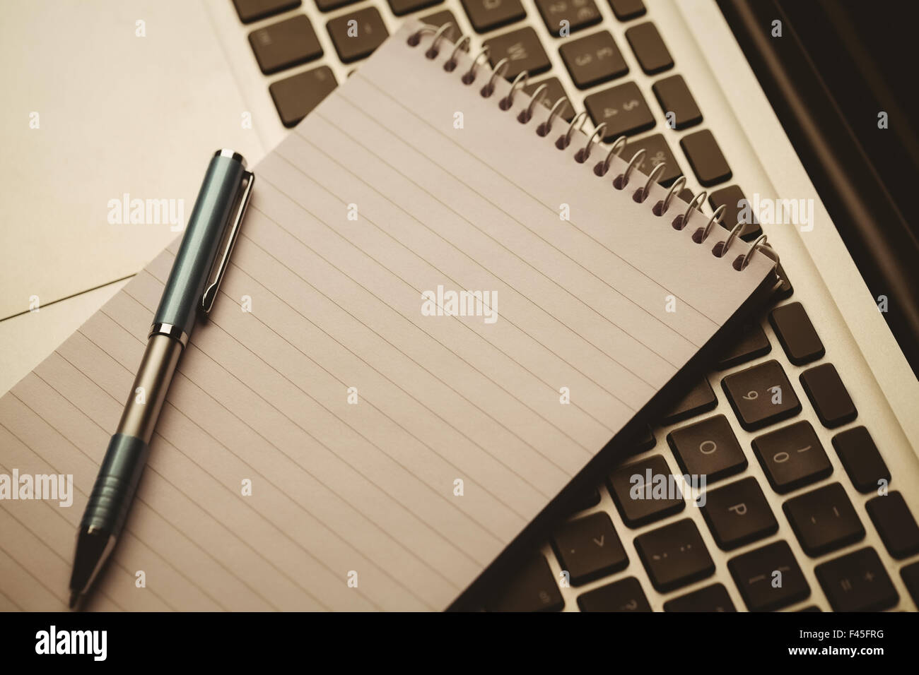 Notepad on laptop Stock Photo - Alamy