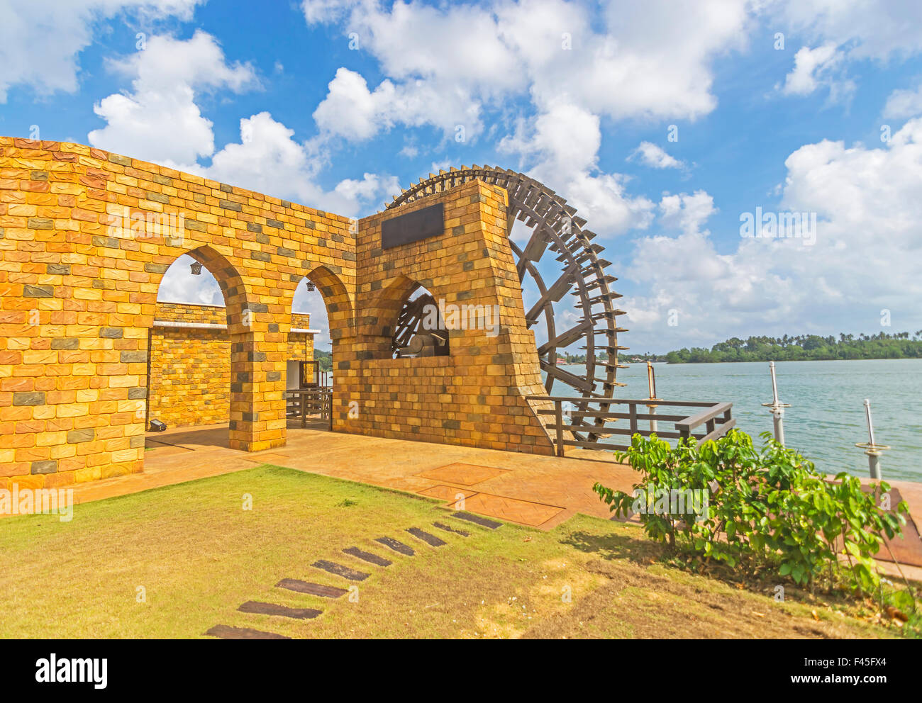 wall water wheel with blue skies Stock Photo - Alamy