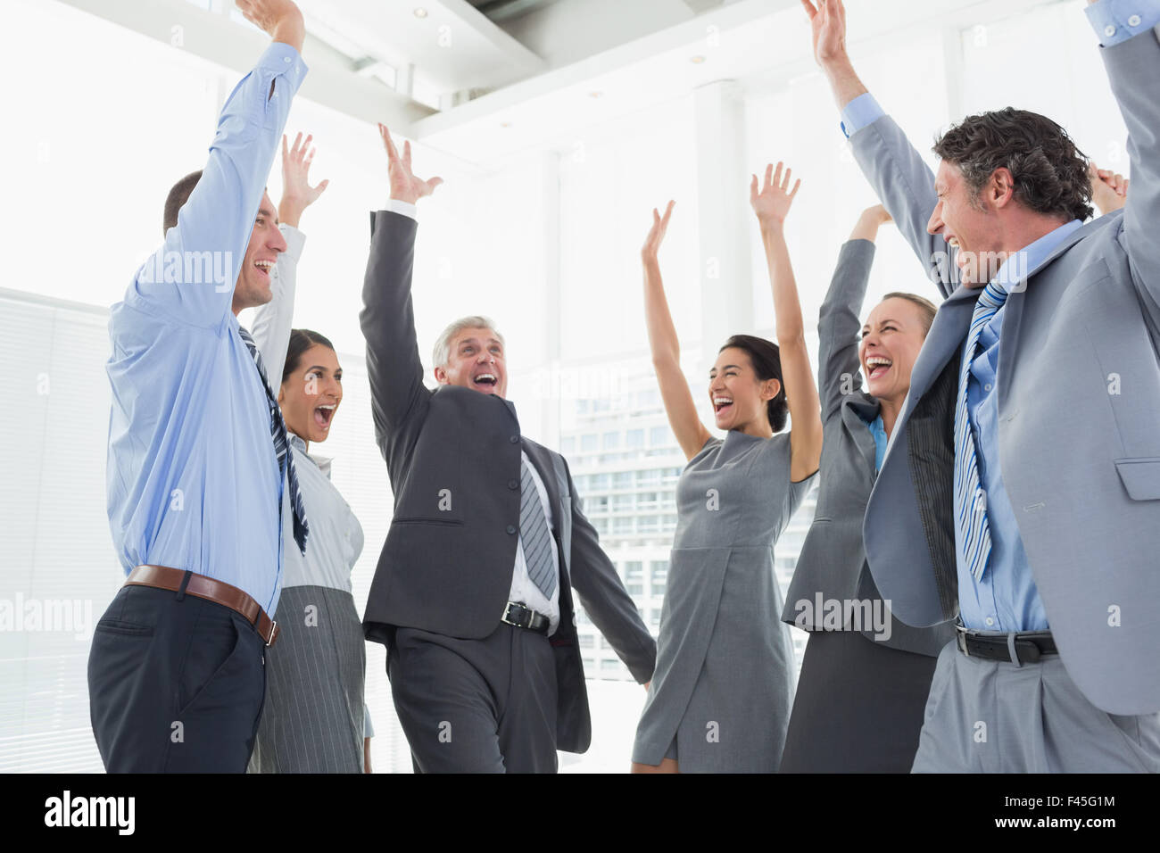 Business team celebrating a good job Stock Photo - Alamy
