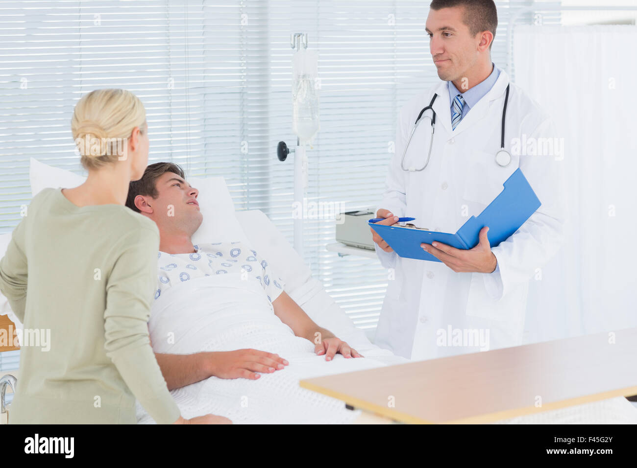 Doctor checking his patient Stock Photo - Alamy
