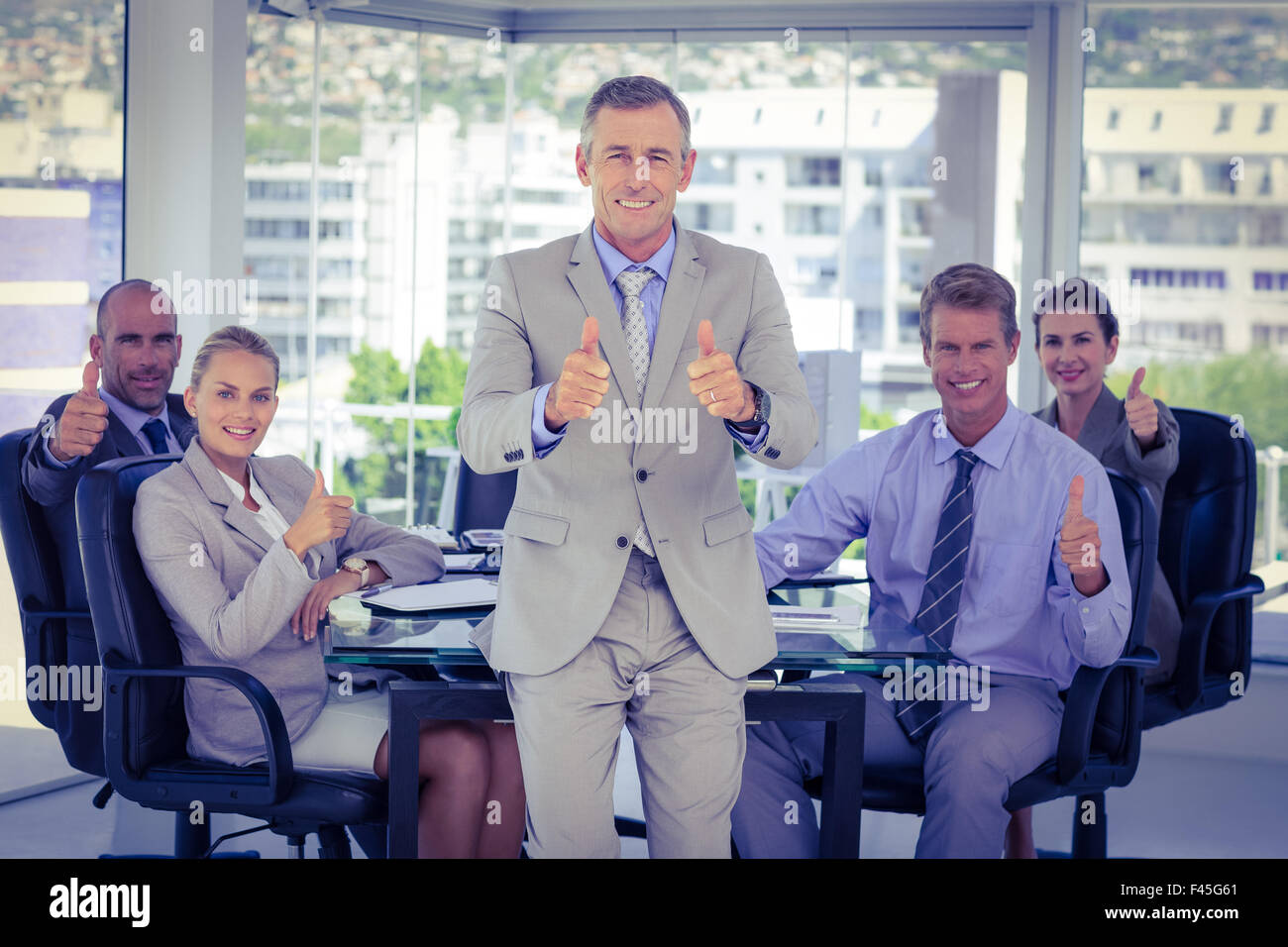 Positive young team showing hi-res stock photography and images - Alamy