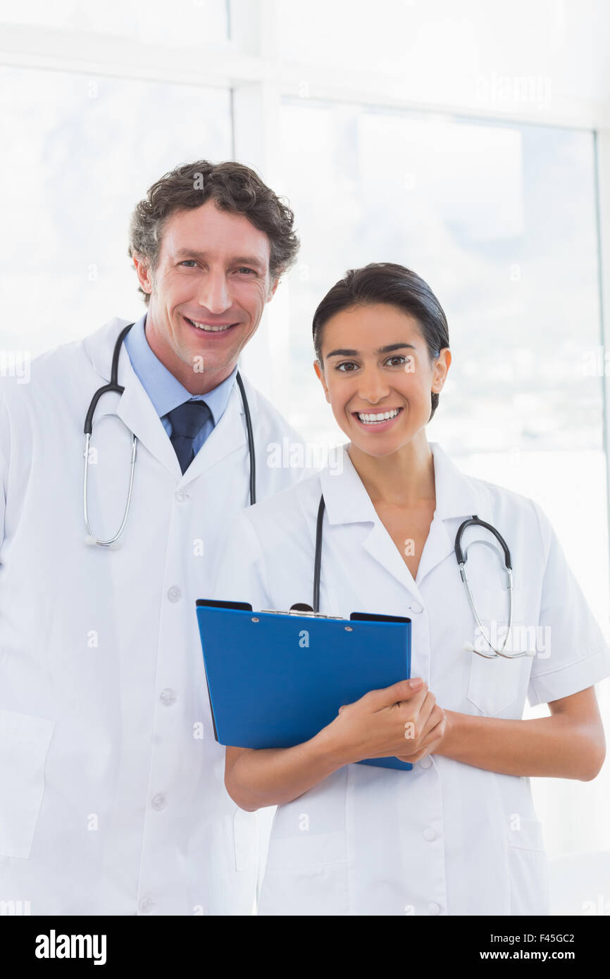 Happy doctors looking at camera Stock Photo - Alamy