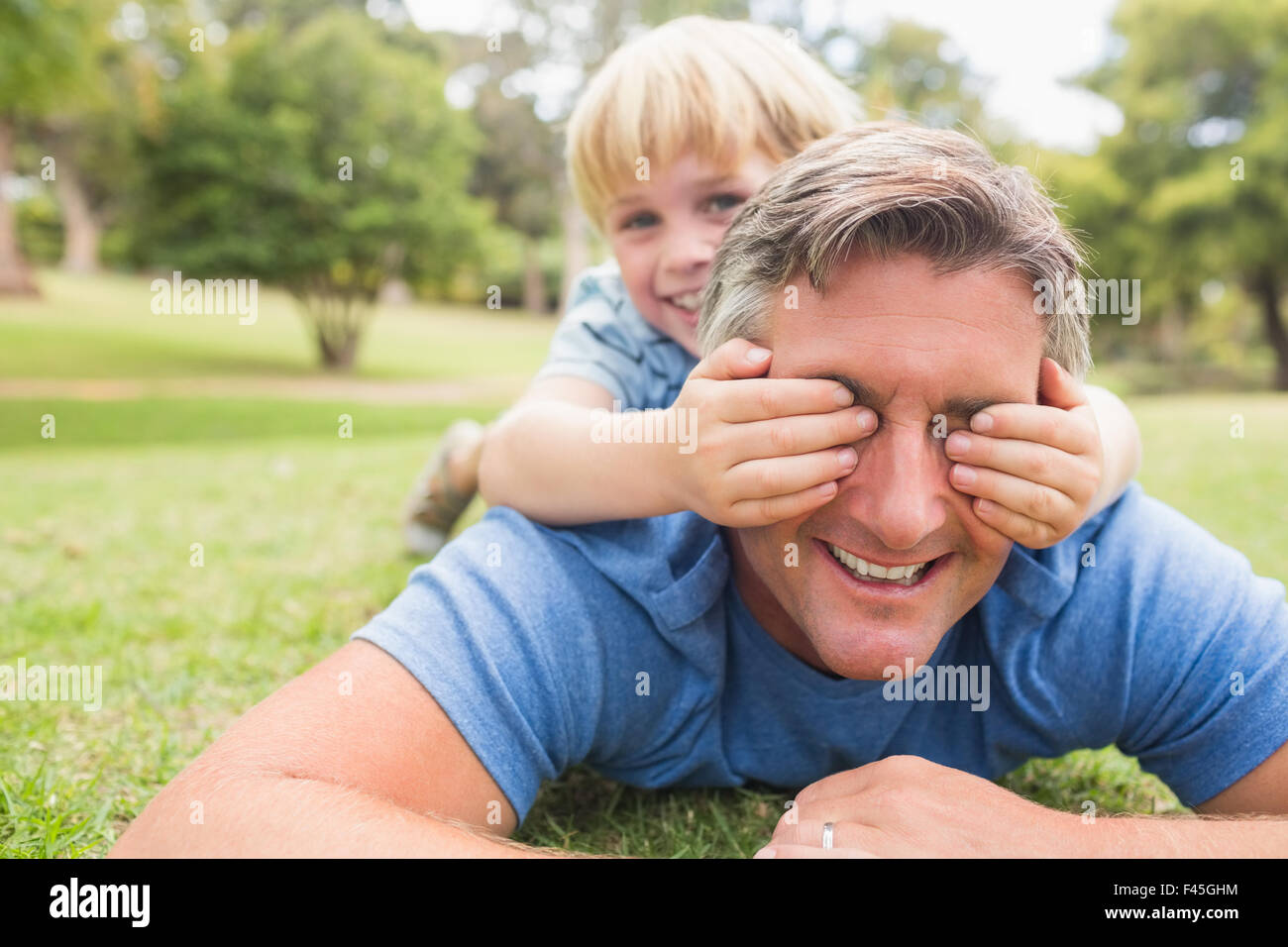 Happy father and his son smiling at camera Stock Photo - Alamy
