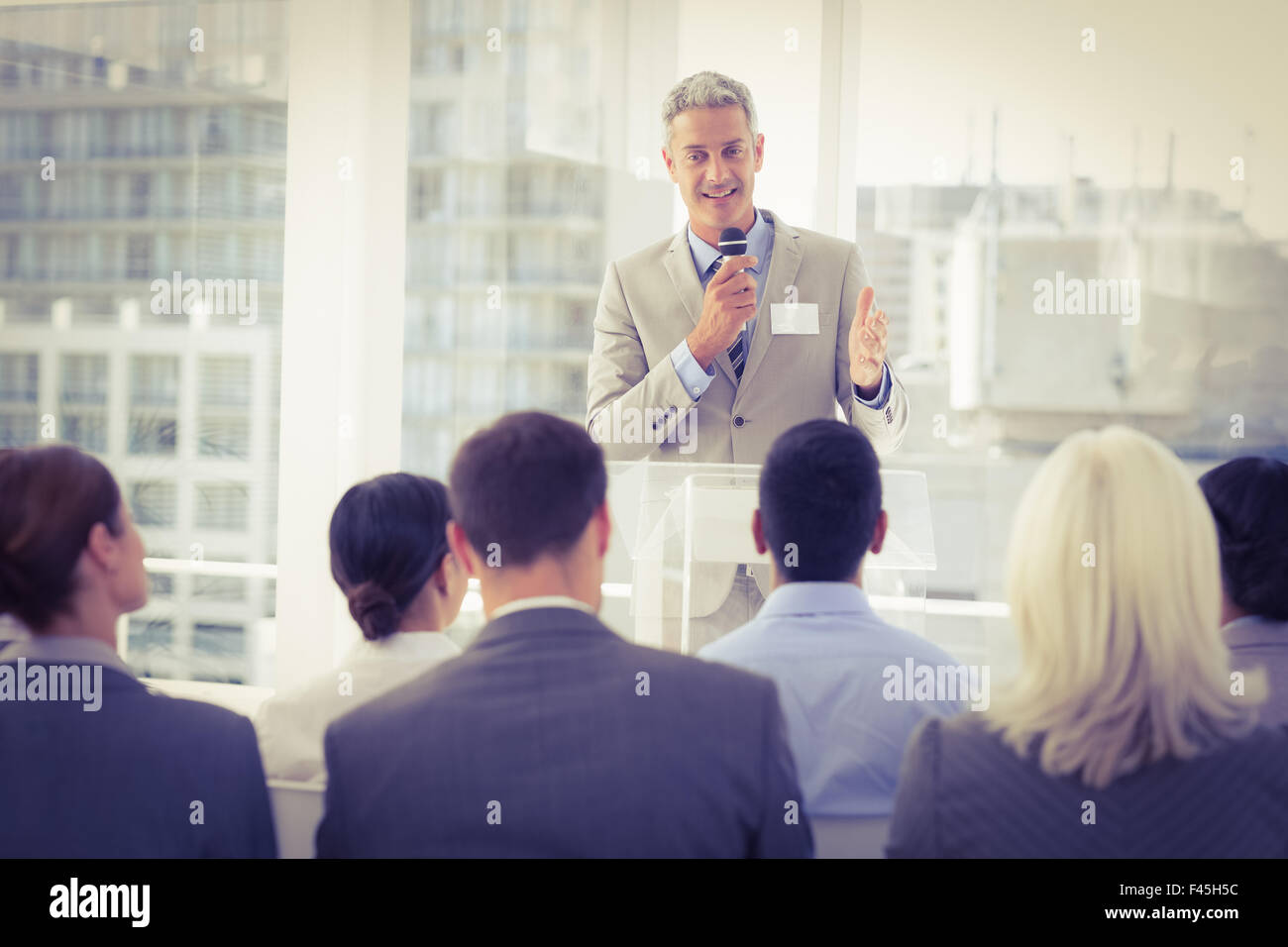 Businessman doing speech during meeting Stock Photo - Alamy