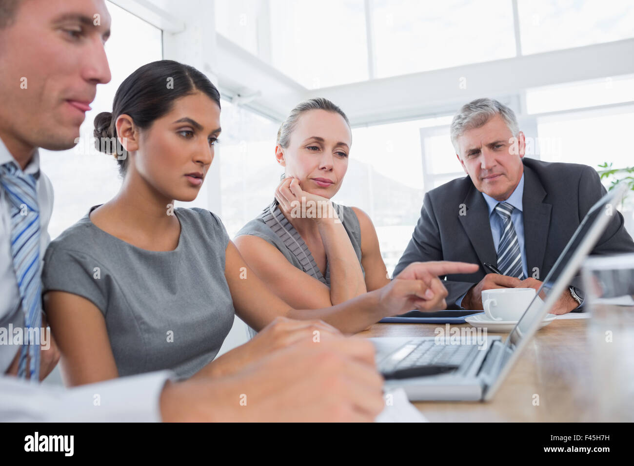 Concentrated business team during meeting Stock Photo - Alamy