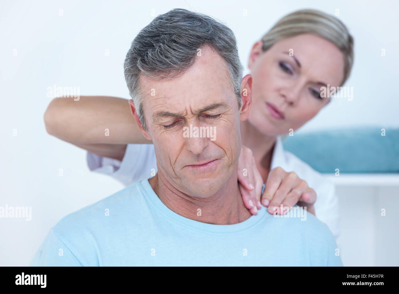 Doctor stretching her patient neck Stock Photo - Alamy