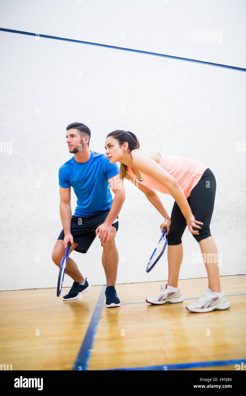 Couple tired after a squash game Stock Photo - Alamy