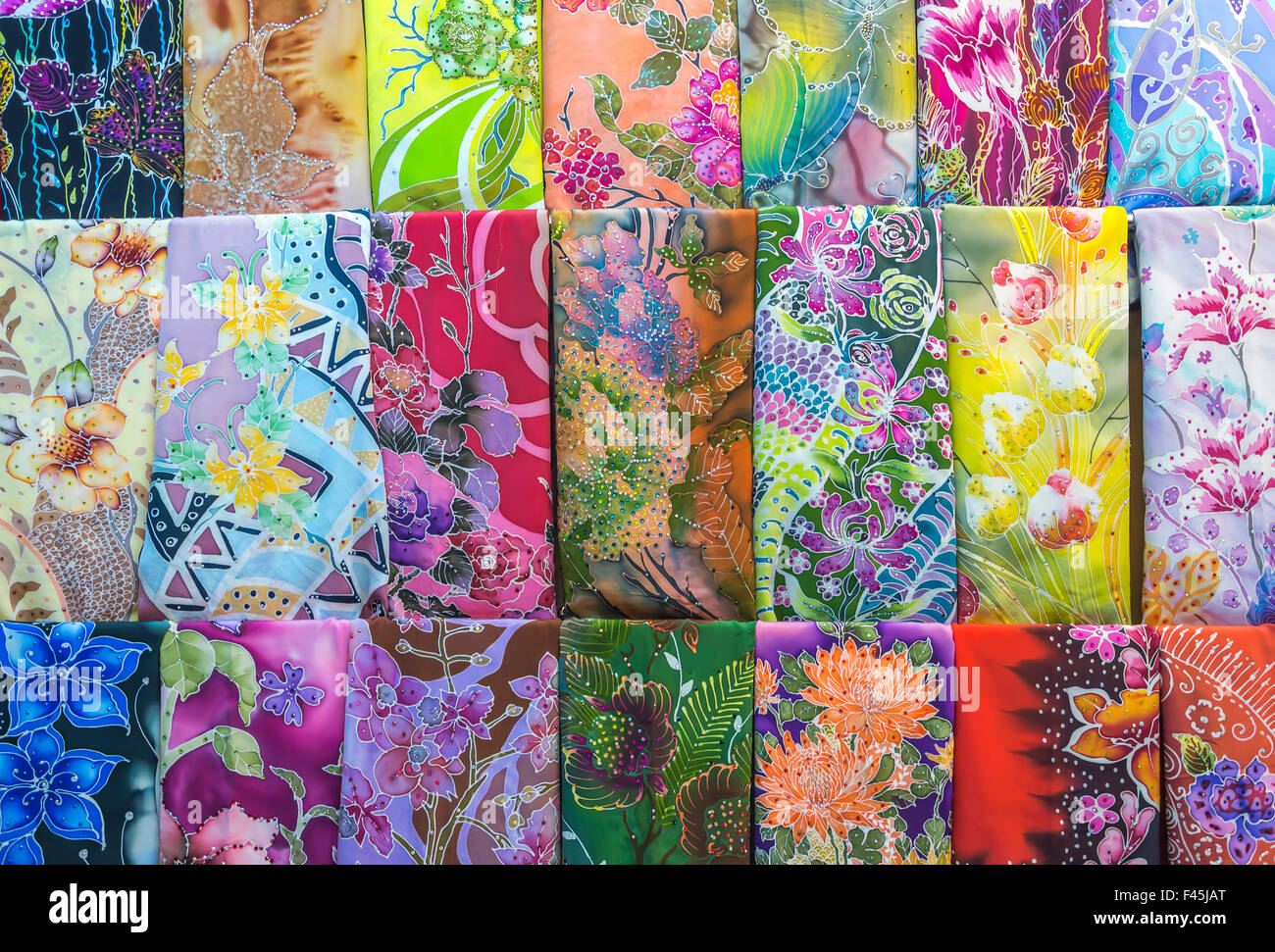 Mass produced colored textile in a traditional east market in Malaysia ...