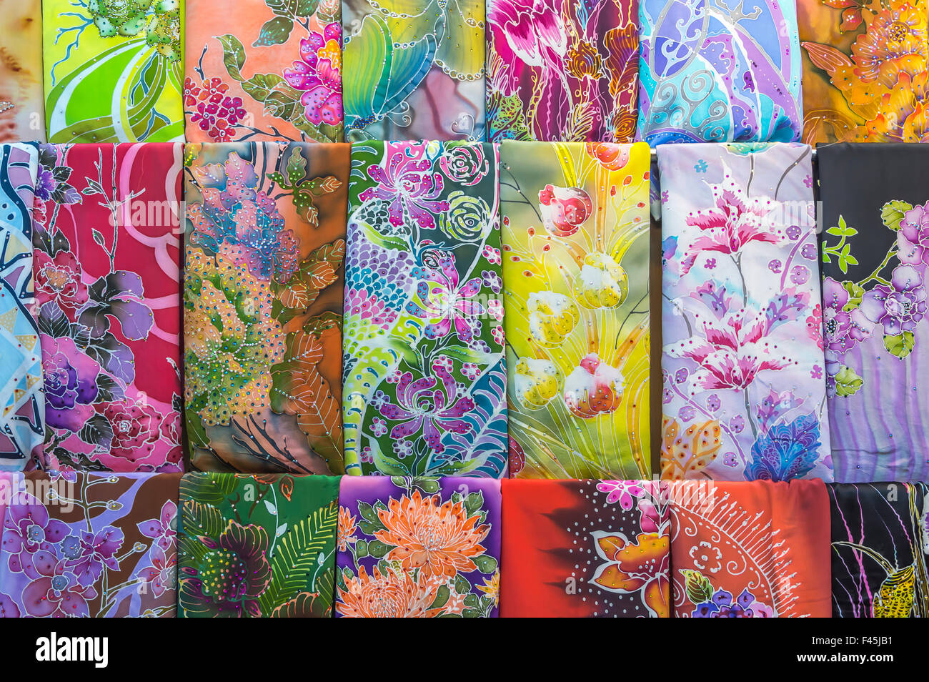 Mass produced colored textile in a traditional east market in Malaysia ...
