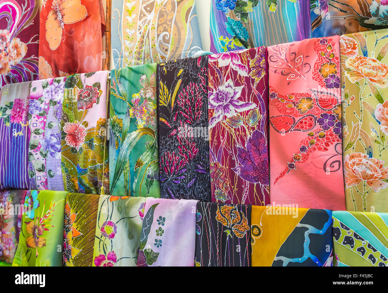 Mass produced colored textile in a traditional east market in Malaysia ...