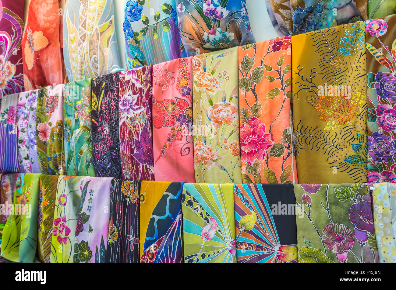Mass produced colored textile in a traditional east market in Malaysia ...