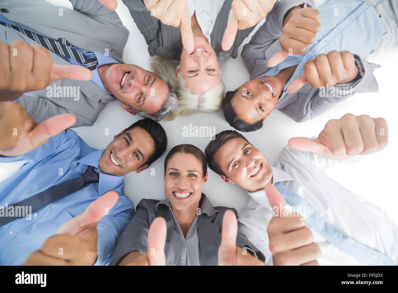 Business people gesturing thumbs up Stock Photo - Alamy