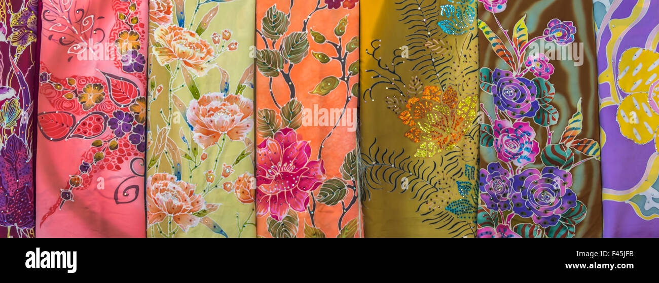 Mass produced colored textile in a traditional east market in Malaysia ...