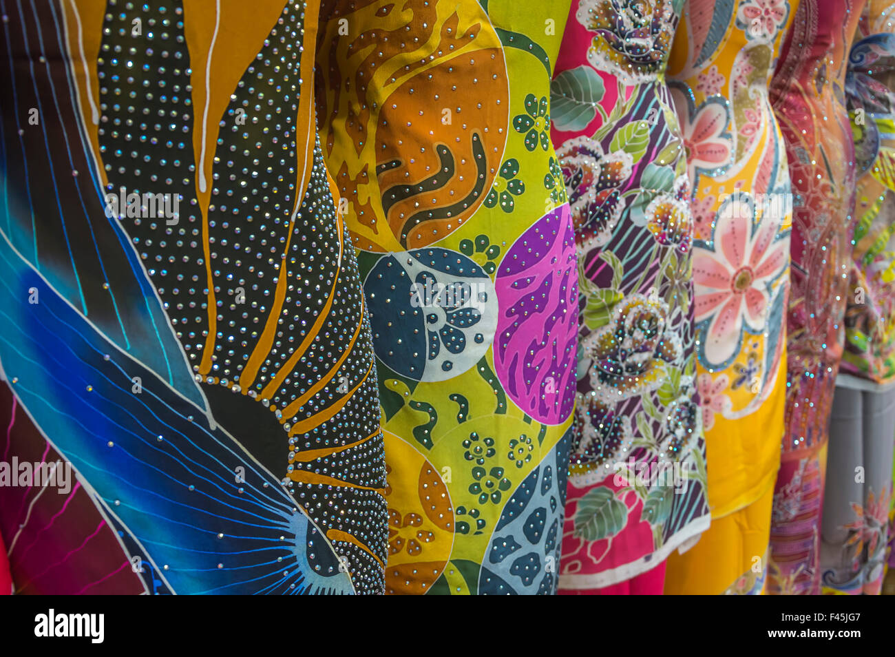 Mass produced colored textile in a traditional east market in Malaysia ...