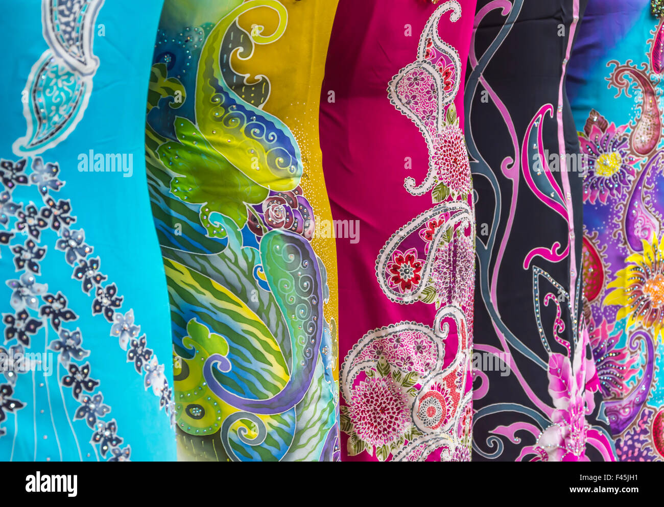 Mass produced colored textile in a traditional east market in Malaysia ...