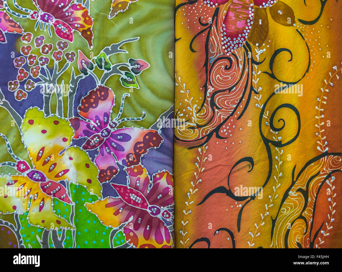 Mass produced colored textile in a traditional east market in Malaysia ...