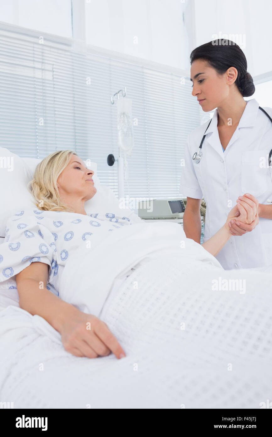 Doctor taking care of patient Stock Photo - Alamy