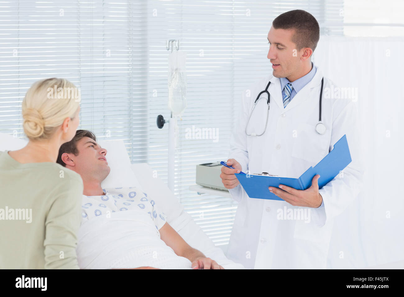 Doctor checking his patient Stock Photo - Alamy