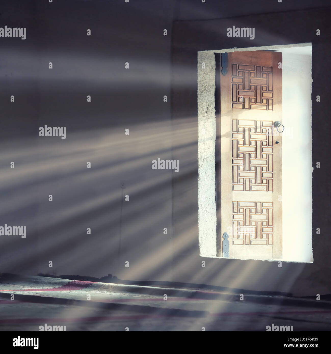 Light entering through open door Stock Photo - Alamy