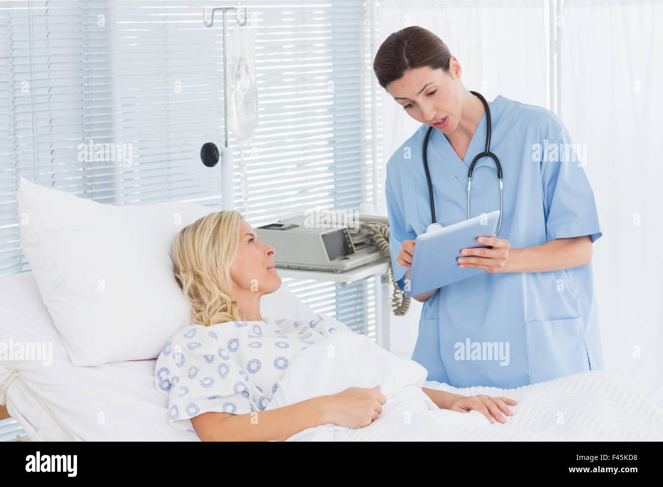 Doctor taking care of patient Stock Photo - Alamy