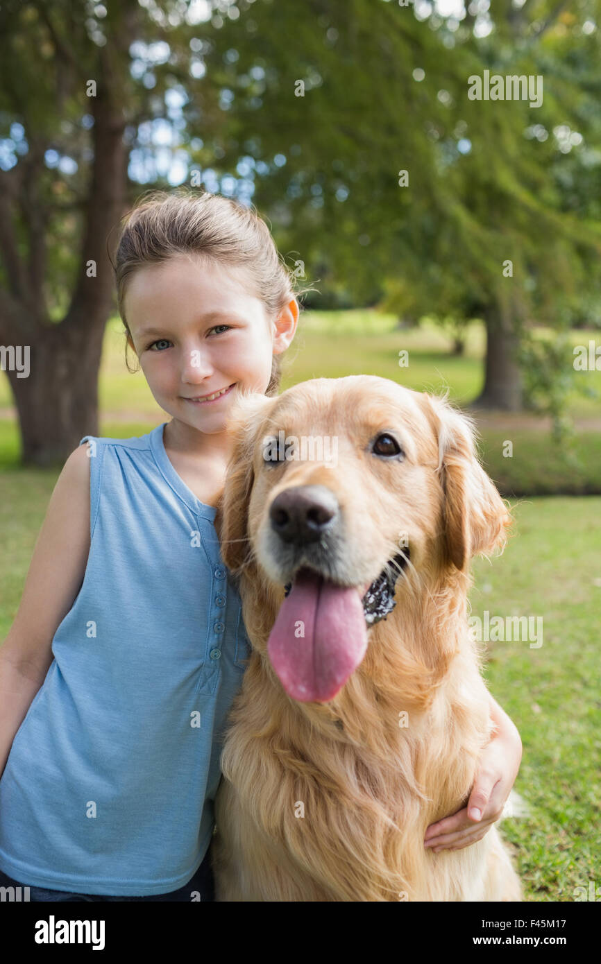 Little girl with her dog in the park Stock Photo - Alamy