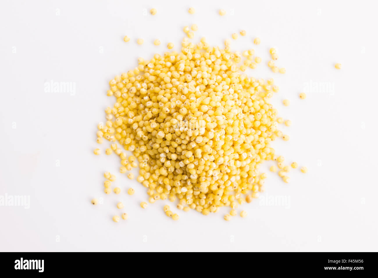 Heap of millet groats on white Stock Photo - Alamy