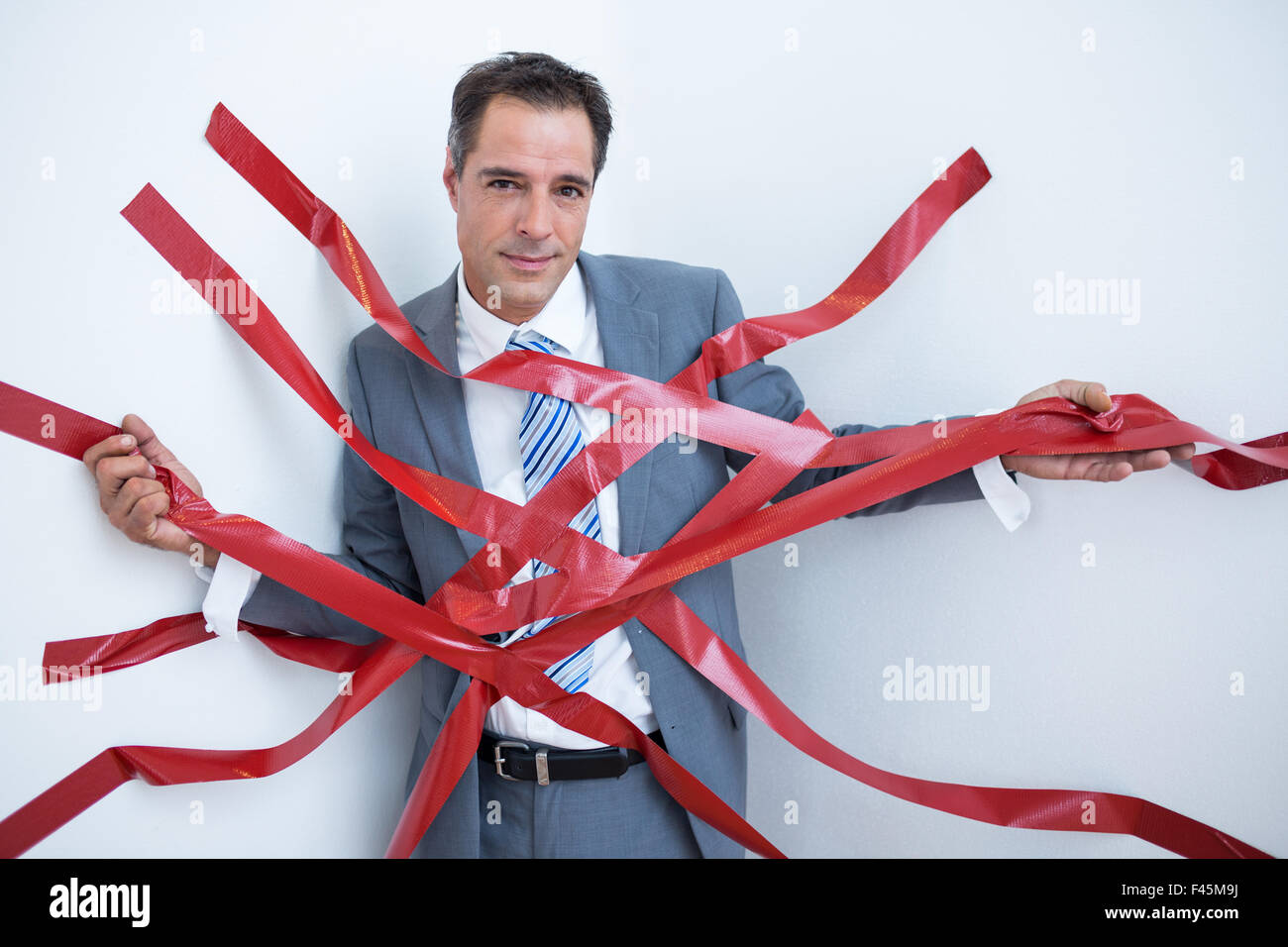 Man red tape hi-res stock photography and images - Alamy