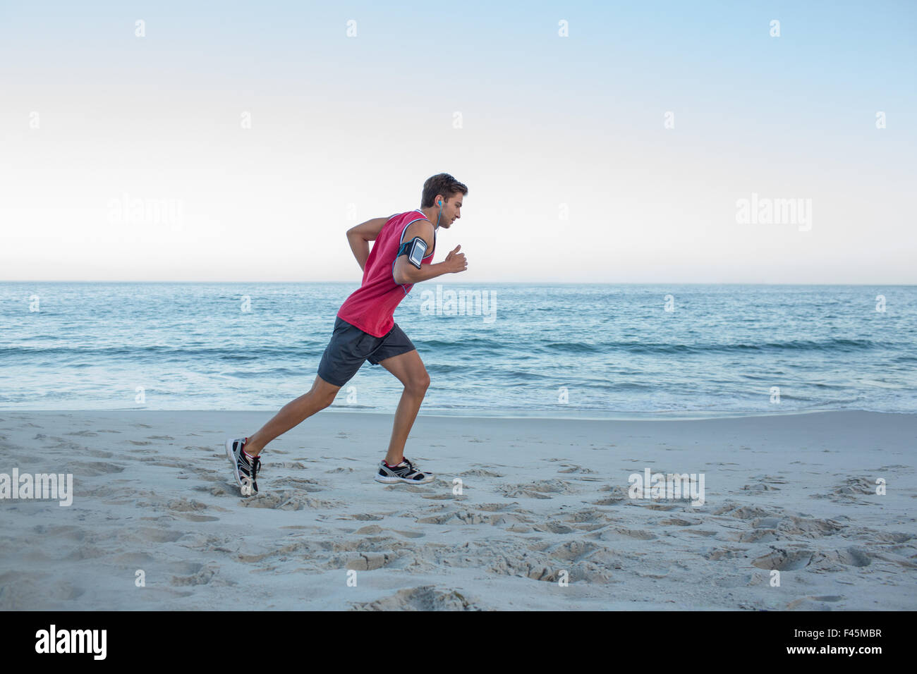 Handsome fit man running Stock Photo - Alamy