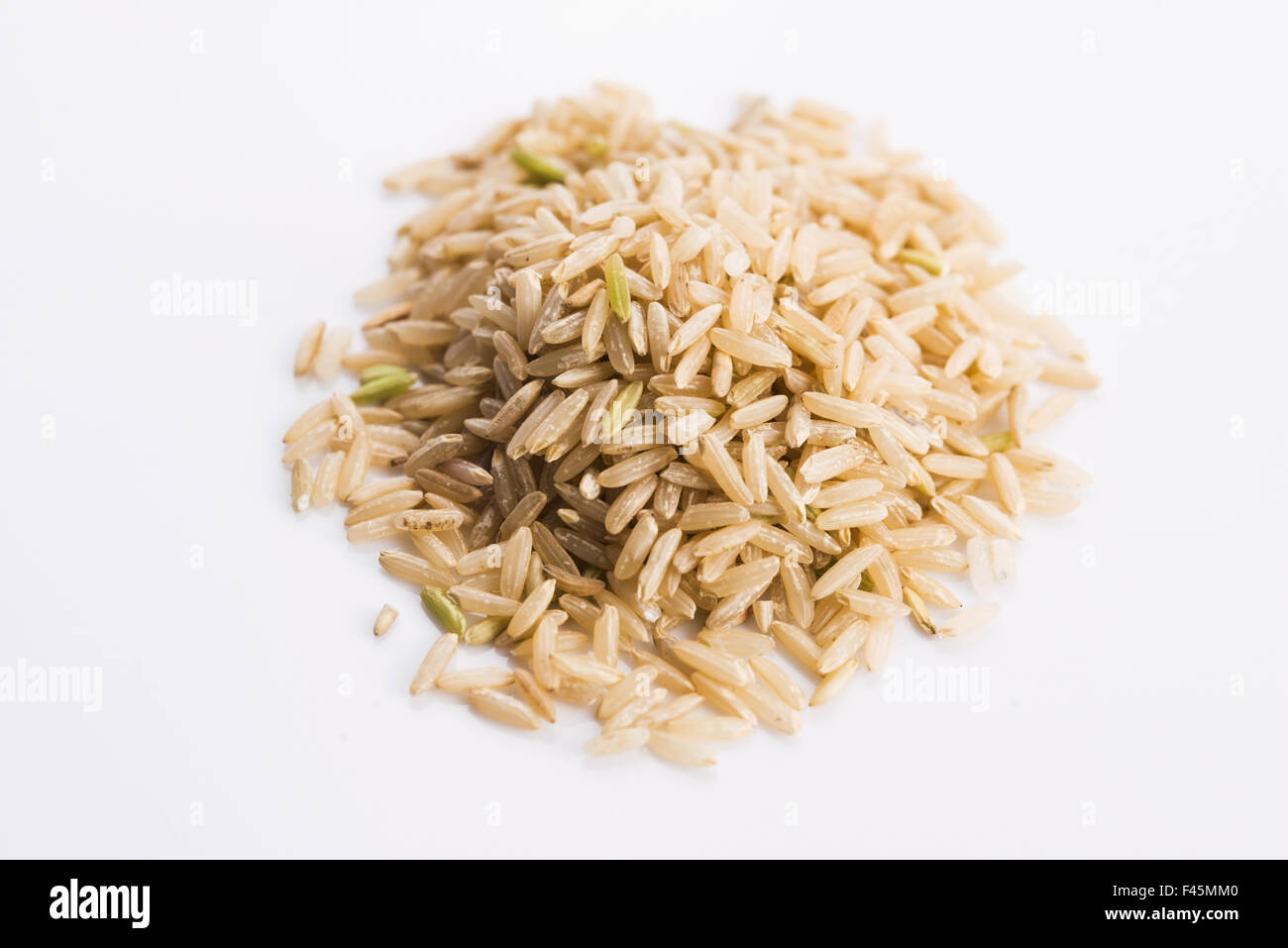 Whole rice pile on white background Stock Photo - Alamy