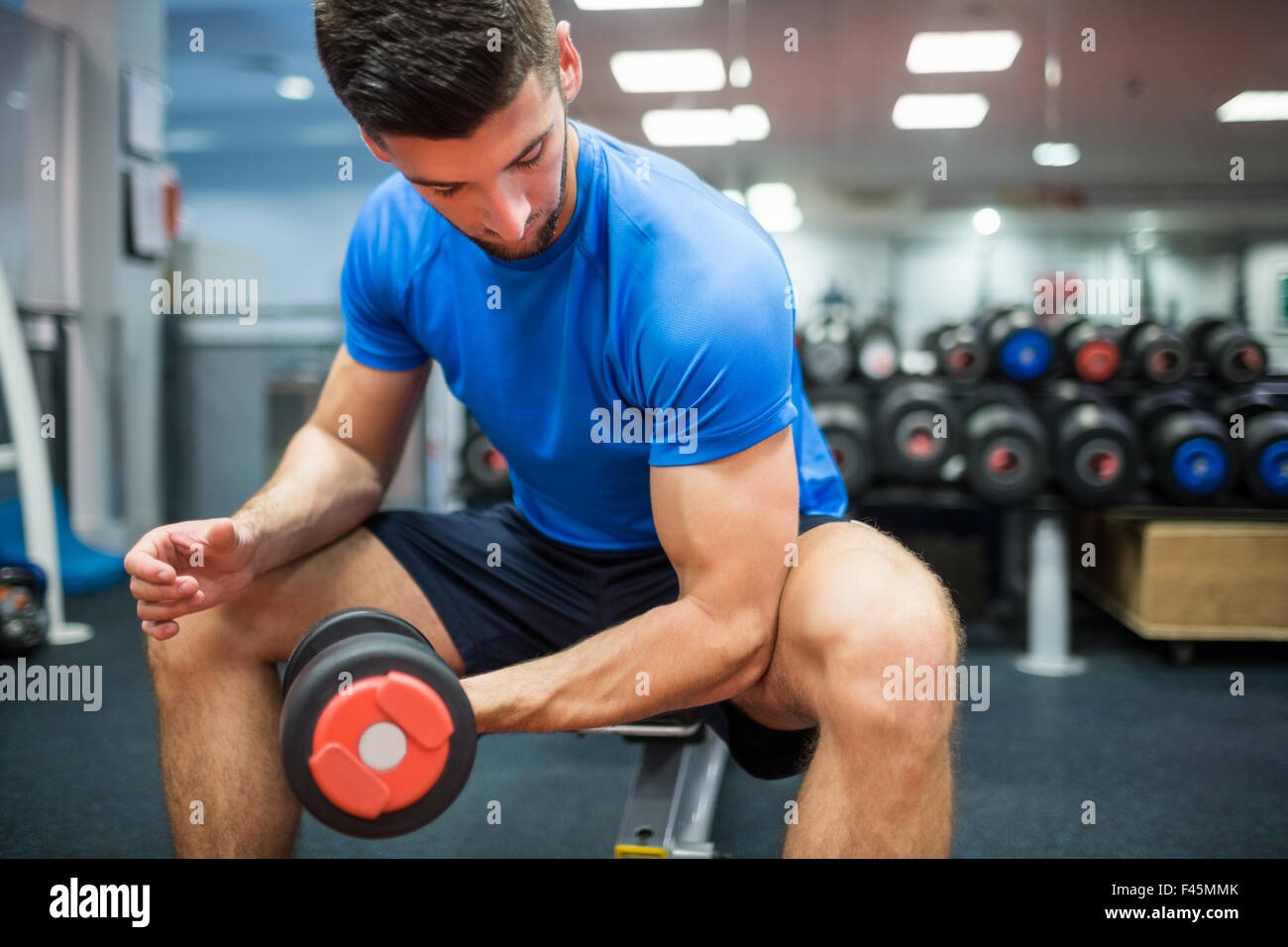 Close up of fit man working out with weights Stock Photo - Alamy