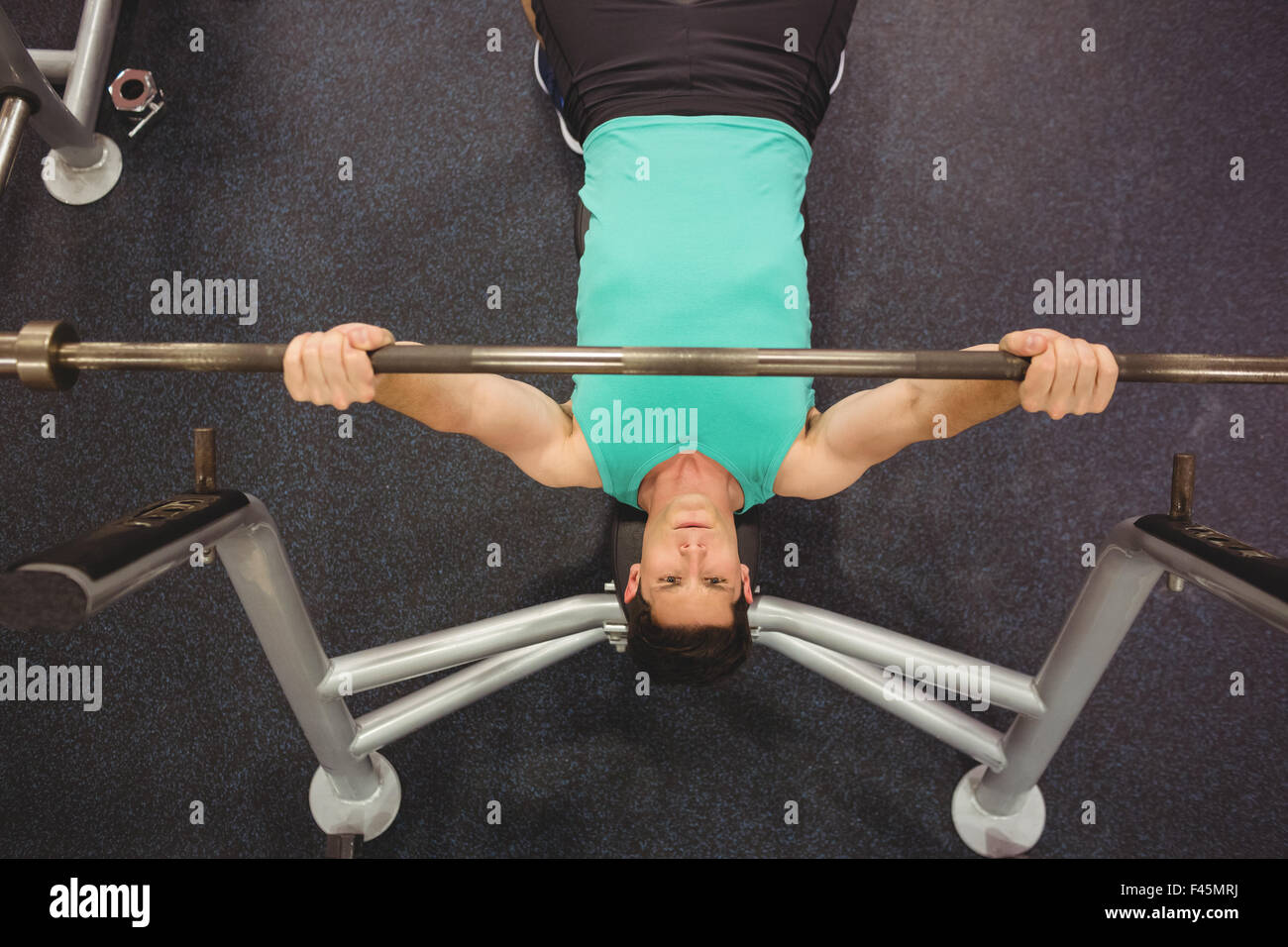 Fit man lifting heavy barbell Stock Photo - Alamy
