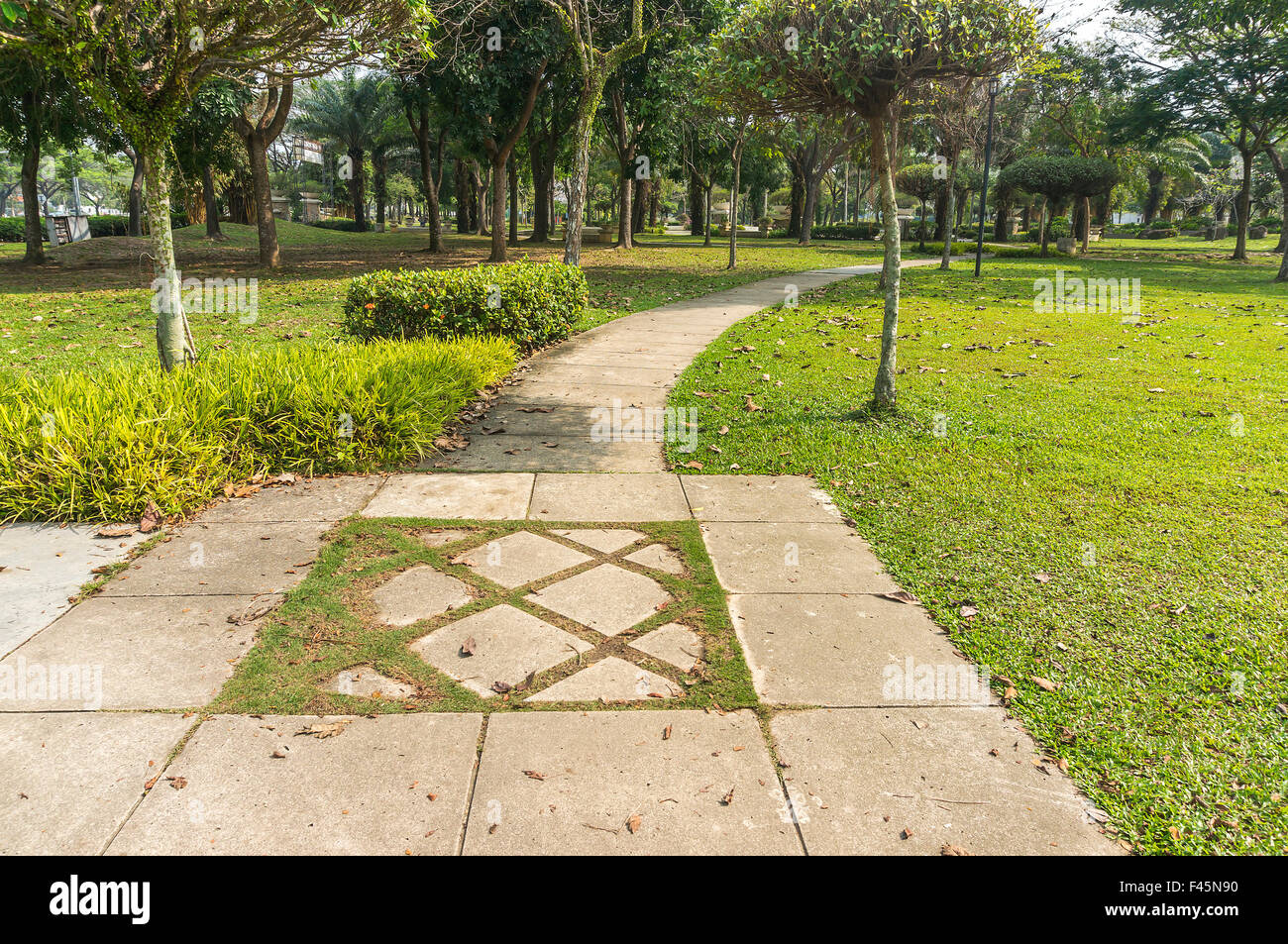Jogging track at green garden Stock Photo - Alamy