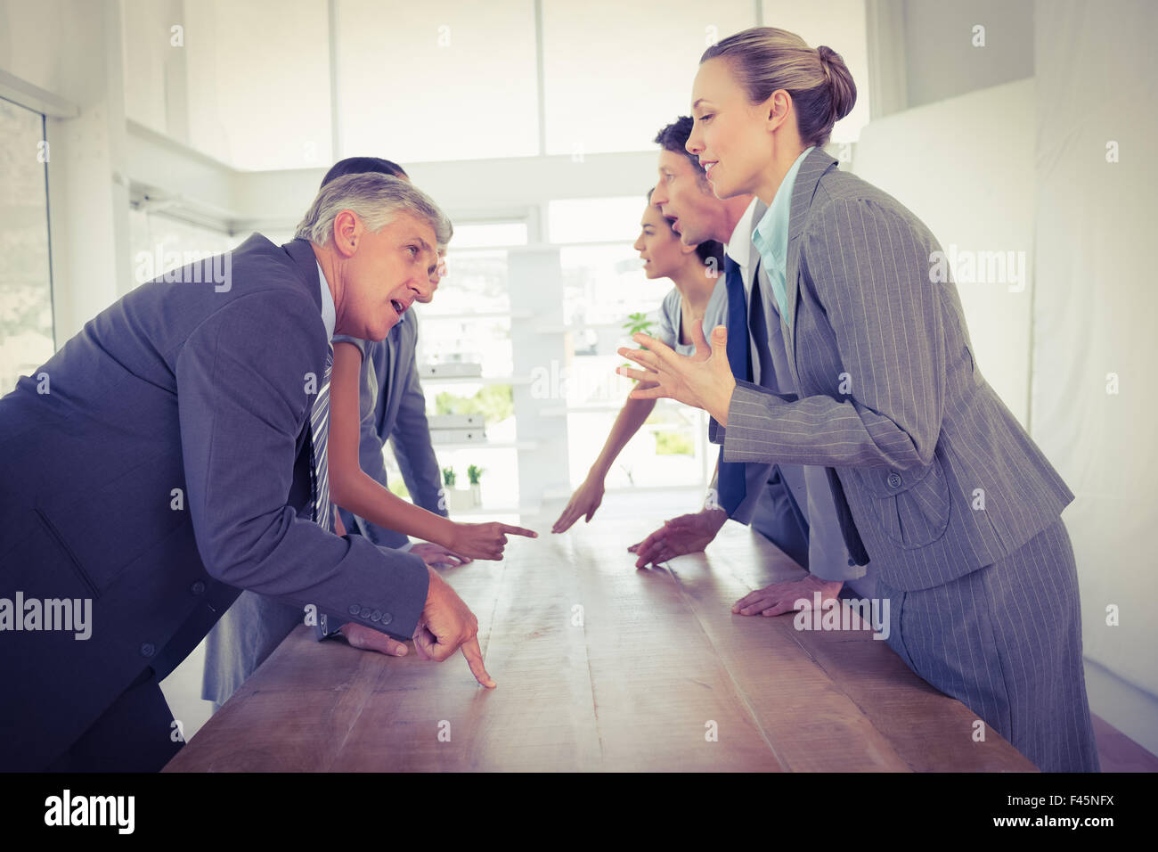 Business executives standing together talking hi-res stock photography ...