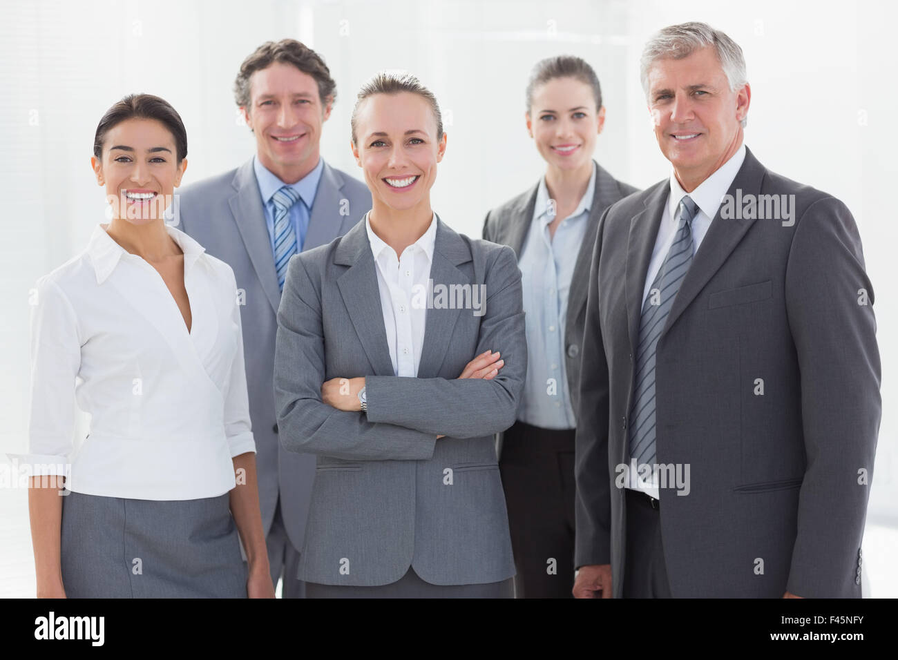 Business team looking at camera Stock Photo - Alamy