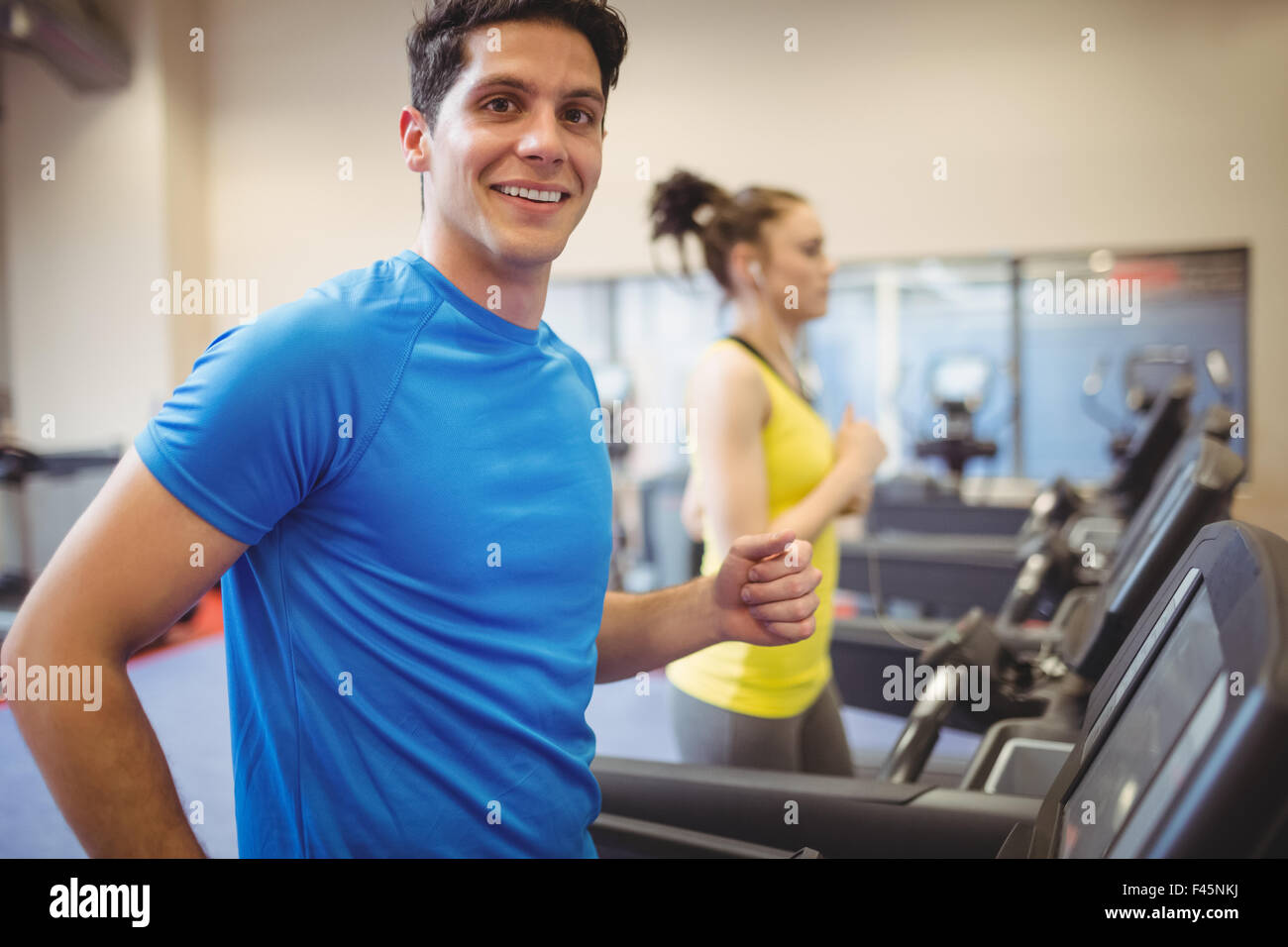 Fit people using the treadmill Stock Photo - Alamy